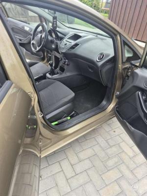 Brown Ford Fiesta 2013 in Plunge, with an engine capacity of 1.24 L and mileage of 189 thousand km for 3400 €, photo 10 on AUTOMOTO.COM.LV