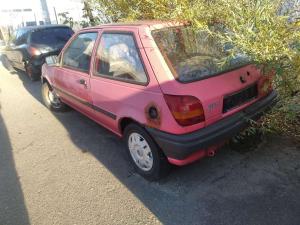 Red Ford Fiesta 1991 in Panevezys, with an engine capacity of 1.12 L and mileage of 222 thousand km for 265 €, photo 3 on AUTOMOTO.COM.LV