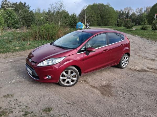 Red Ford Fiesta 2009 in Raseiniai, with an engine capacity of 1.60 L and mileage of 201 thousand km for 1700 €, photo 1 on AUTOMOTO.COM.LV