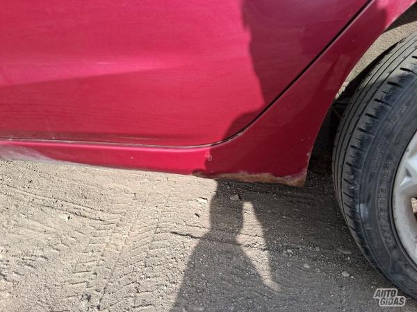 Red Ford Fiesta 2009 in Raseiniai, with an engine capacity of 1.60 L and mileage of 201 thousand km for 1700 €, photo 6 on AUTOMOTO.COM.LV