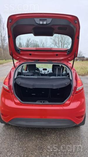 Red Ford Fiesta 2009 in Ogre, with an engine capacity of 1.30 L and mileage of 180 thousand km for 2399 €, photo 11 on AUTOMOTO.COM.LV