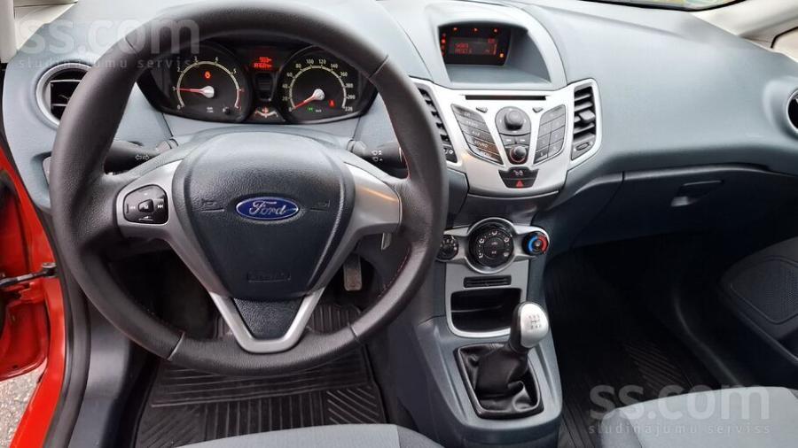 Red Ford Fiesta 2009 in Ogre, with an engine capacity of 1.30 L and mileage of 180 thousand km for 2399 €, photo 12 on AUTOMOTO.COM.LV