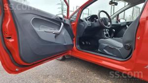Red Ford Fiesta 2009 in Ogre, with an engine capacity of 1.30 L and mileage of 180 thousand km for 2399 €, photo 16 on AUTOMOTO.COM.LV