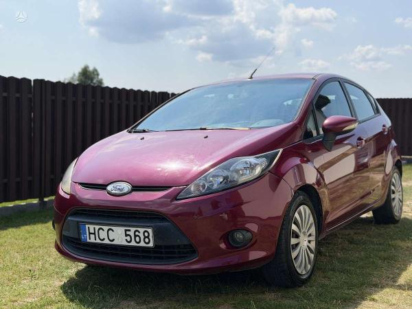 Red Ford Fiesta 2009 in Vilnius, with an engine capacity of 1.40 L and mileage of 215 thousand km for 950 €, photo 1 on AUTOMOTO.COM.LV