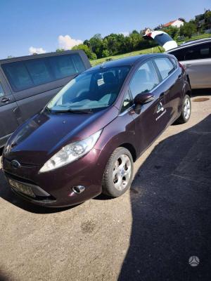 Red Ford Fiesta 2011 in Klaipeda, with an engine capacity of 1.24 L and mileage of 169 thousand km for 499 €, photo  on AUTOMOTO.COM.LV