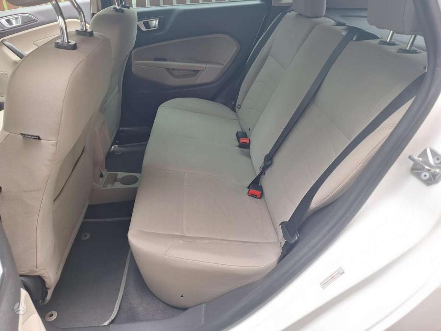 White Ford Fiesta 2016 in Siauliai, with an engine capacity of 1.60 L and mileage of 61 thousand km for 6800 €, photo 13 on AUTOMOTO.COM.LV