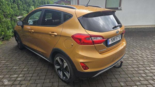 Yellow Ford Fiesta 2018 in Kaunas, with an engine capacity of 1.00 L and mileage of 150 thousand km for 9300 €, photo 3 on AUTOMOTO.COM.LV