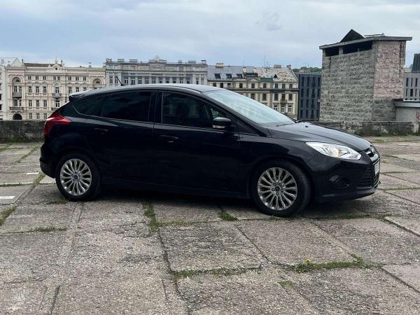 Black Ford Focus 2012 in Vilnius, with an engine capacity of 1.56 L and mileage of 214 thousand km for 2100 €, photo 4 on AUTOMOTO.COM.LV