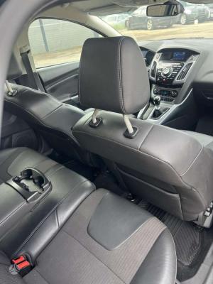 Black Ford Focus 2011 in Utena, with an engine capacity of 1.60 L and mileage of 132 thousand km for 3900 €, photo 12 on AUTOMOTO.COM.LV