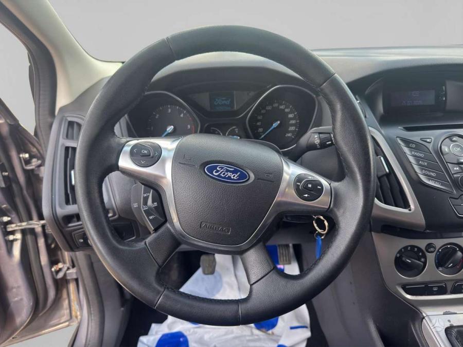Brown Ford Focus 2011 in Kaunas, with an engine capacity of 1.60 L and mileage of 284 thousand km for 3990 €, photo 11 on AUTOMOTO.COM.LV