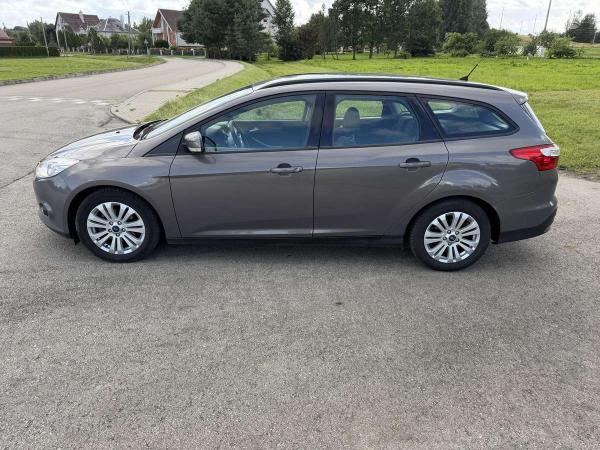 Brown Ford Focus 2013 in Kelme, with an engine capacity of 1.56 L and mileage of 274 thousand km for 2899 €, photo 4 on AUTOMOTO.COM.LV