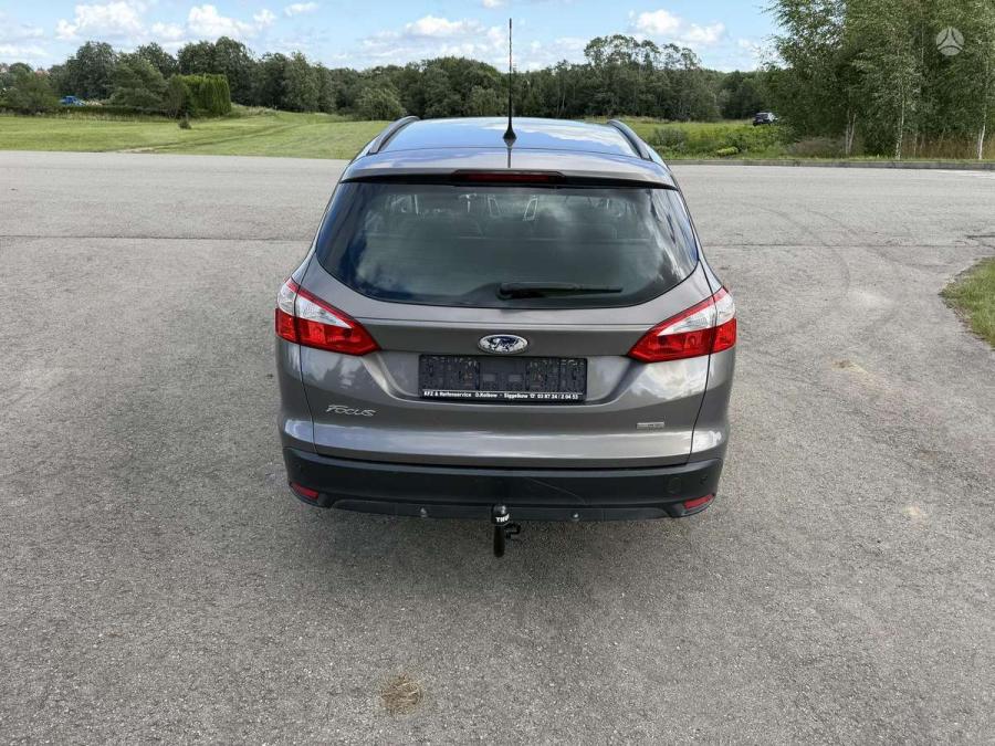 Brown Ford Focus 2013 in Kelme, with an engine capacity of 1.56 L and mileage of 274 thousand km for 2899 €, photo 7 on AUTOMOTO.COM.LV