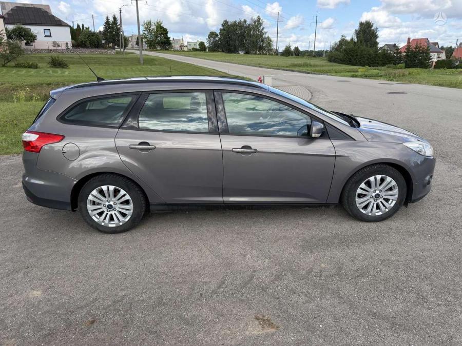 Brown Ford Focus 2013 in Kelme, with an engine capacity of 1.56 L and mileage of 274 thousand km for 2899 €, photo 9 on AUTOMOTO.COM.LV