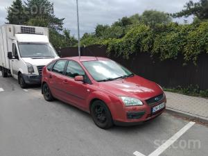 Red Ford Focus 2007 in Riga, with an engine capacity of 1.40 L and mileage of 186 thousand km for 770 €, photo 1 on AUTOMOTO.COM.LV