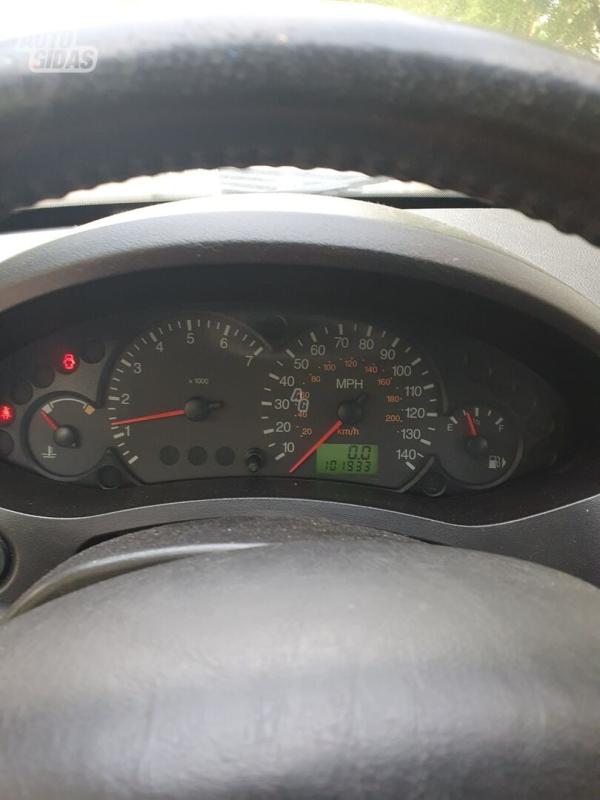 Red Ford Focus 2006 in Kaunas, with an engine capacity of 2.00 L and mileage of 164 thousand km for 320 €, photo 7 on AUTOMOTO.COM.LV
