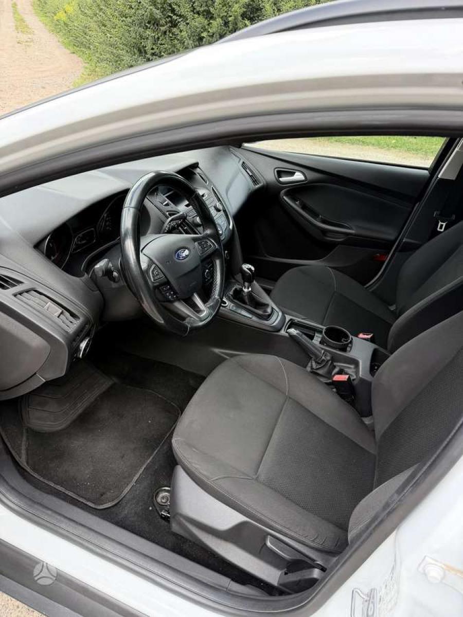 White Ford Focus 2015 in Kaunas, with an engine capacity of 1.56 L and mileage of 197 thousand km for 3999 €, photo 10 on AUTOMOTO.COM.LV