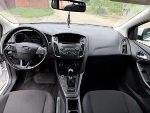 White Ford Focus 2015 in Kaunas, with an engine capacity of 1.56 L and mileage of 197 thousand km for 3999 €, photo 12 on AUTOMOTO.COM.LV