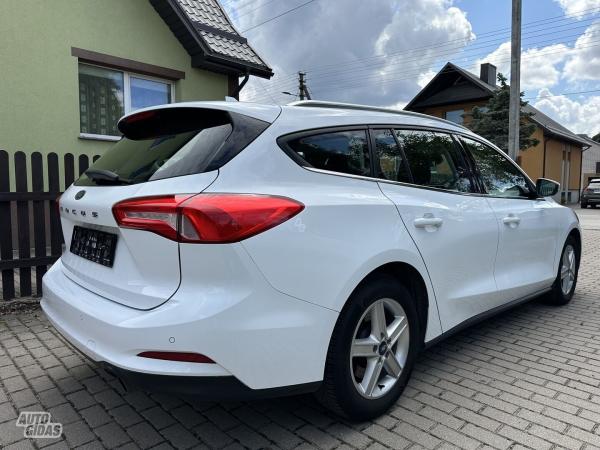 White Ford Focus 2019 in Prienai, with an engine capacity of 1.00 L and mileage of 142 thousand km for 7100 €, photo 6 on AUTOMOTO.COM.LV