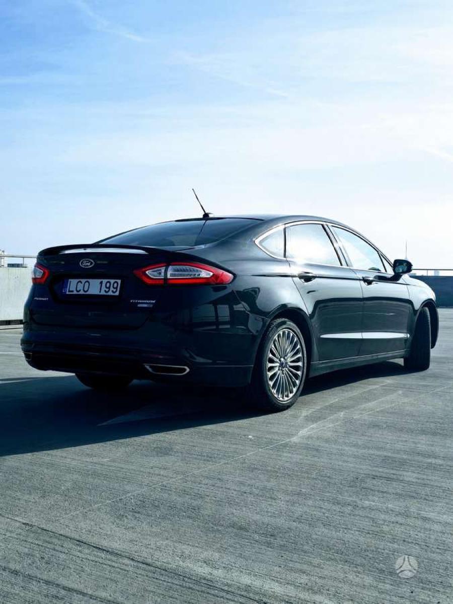 Black Ford Fusion 2013 in Vilnius, with an engine capacity of 2.00 L and mileage of 248 thousand km for 7599 €, photo 4 on AUTOMOTO.COM.LV