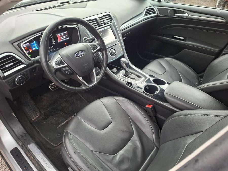 Grey Ford Fusion 2015 in Silute, with an engine capacity of 2.00 L and mileage of 195 thousand km for 4750 €, photo 11 on AUTOMOTO.COM.LV