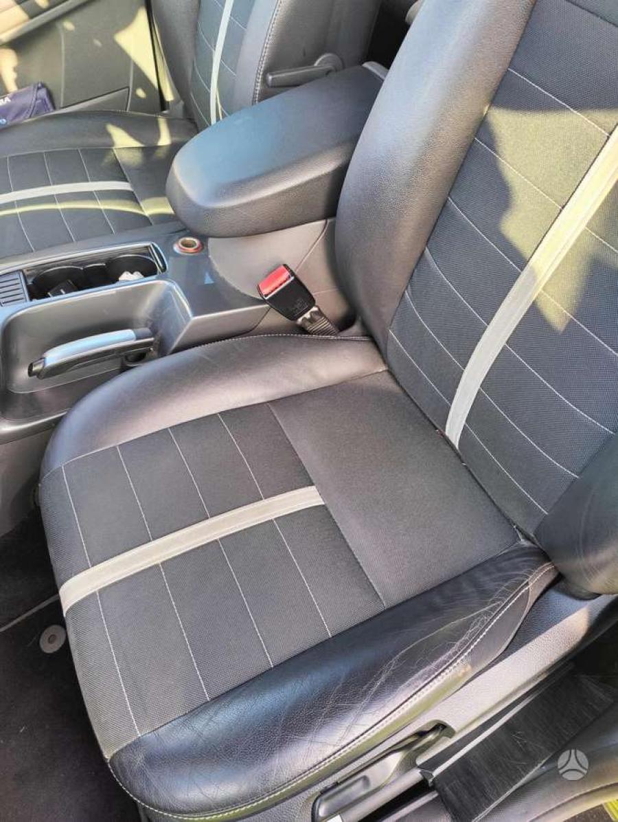 Black Ford Kuga 2012 in Kedainiai, with an engine capacity of 2.00 L and mileage of 176 thousand km for 6099 €, photo 1 on AUTOMOTO.COM.LV