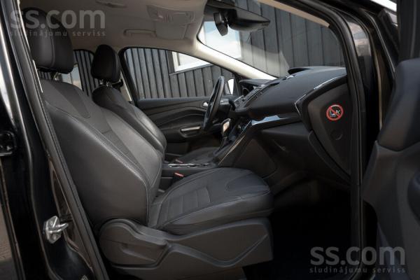 Black Ford Kuga 2013 in Jelgava, with an engine capacity of 2.00 L and mileage of 246 thousand km for 9900 €, photo 7 on AUTOMOTO.COM.LV