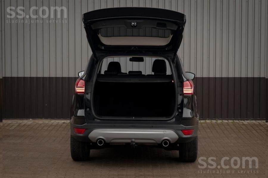 Black Ford Kuga 2013 in Talsi, with an engine capacity of 2.00 L and mileage of 222 thousand km for 7650 €, photo 7 on AUTOMOTO.COM.LV