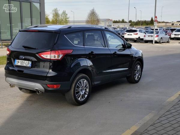 Black Ford Kuga 2014 in Siauliai, with an engine capacity of 2.00 L and mileage of 214 thousand km for 7700 €, photo 4 on AUTOMOTO.COM.LV