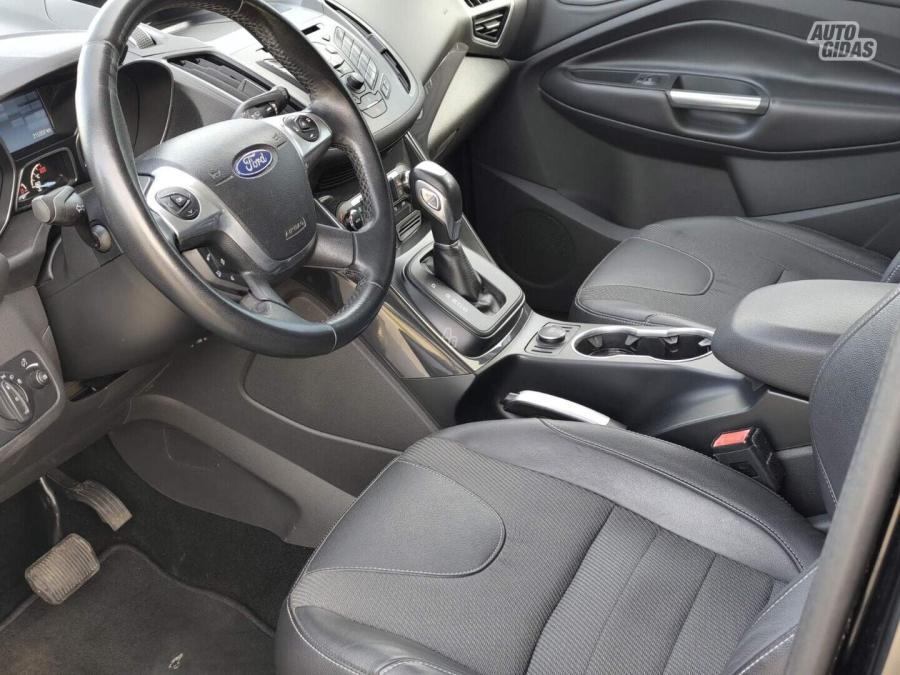 Black Ford Kuga 2014 in Siauliai, with an engine capacity of 2.00 L and mileage of 214 thousand km for 7700 €, photo 11 on AUTOMOTO.COM.LV