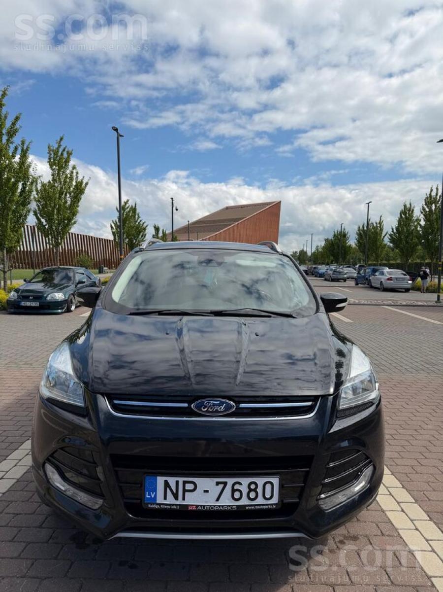 Black Ford Kuga 2014 in Ventspils, with an engine capacity of 2.00 L and mileage of 260 thousand km for 7400 €, photo 1 on AUTOMOTO.COM.LV