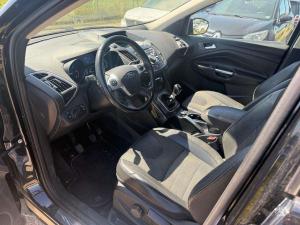 Black Ford Kuga 2014 in Siauliai, with an engine capacity of 2.00 L and mileage of 145 thousand km for 7150 €, photo 9 on AUTOMOTO.COM.LV