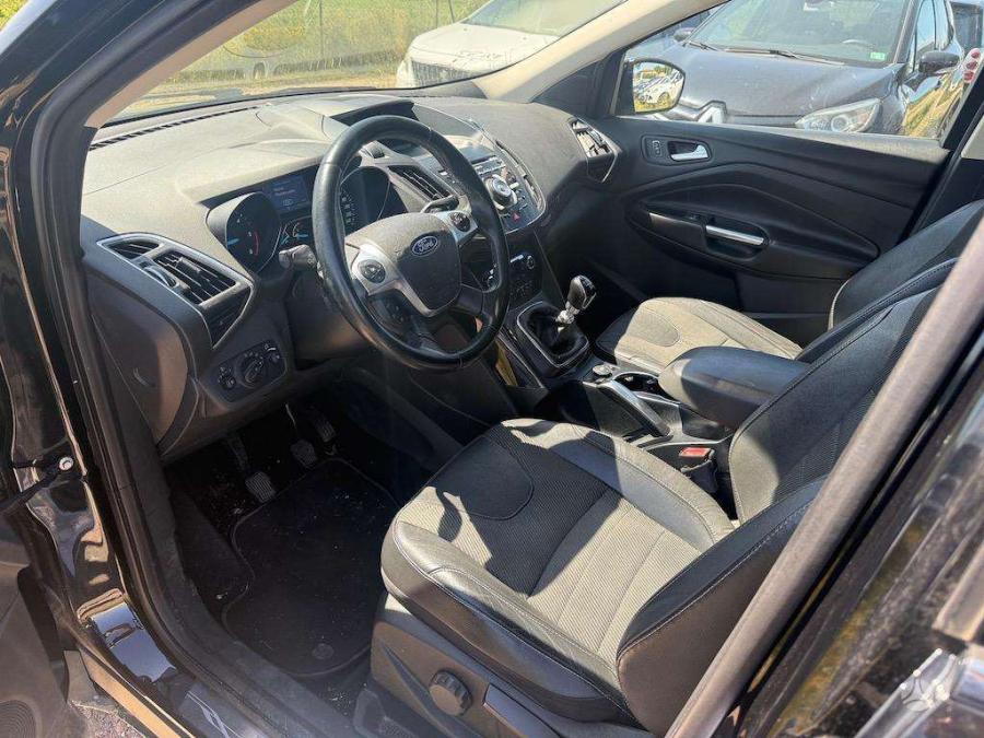 Black Ford Kuga 2014 in Siauliai, with an engine capacity of 2.00 L and mileage of 145 thousand km for 7150 €, photo 9 on AUTOMOTO.COM.LV