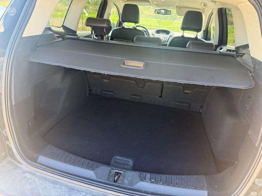 Black Ford Kuga 2014 in Siauliai, with an engine capacity of 2.00 L and mileage of 145 thousand km for 7150 €, photo 19 on AUTOMOTO.COM.LV