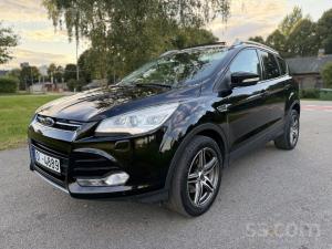 Black Ford Kuga 2014 in Jelgava, with an engine capacity of 2.00 L and mileage of 214 thousand km for 9259 €, photo  on AUTOMOTO.COM.LV