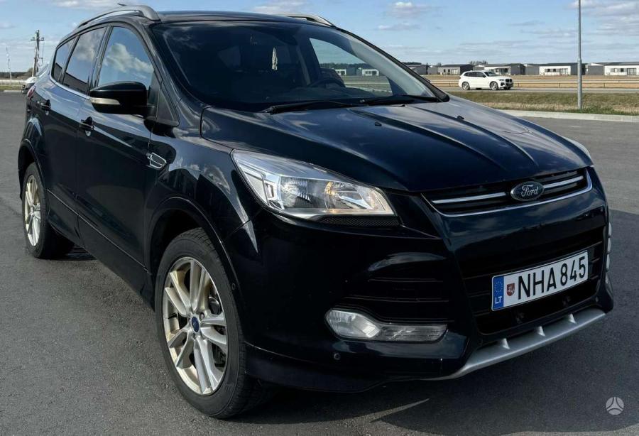 Black Ford Kuga 2015 in Kaunas, with an engine capacity of 2.00 L and mileage of 334 thousand km for 6999 €, photo 1 on AUTOMOTO.COM.LV