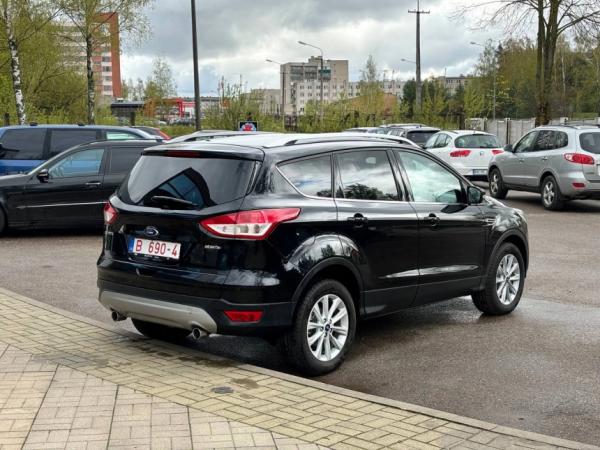 Black Ford Kuga 2015 in Riga, with an engine capacity of 2.00 L and mileage of 203 thousand km for 13499 €, photo 7 on AUTOMOTO.COM.LV