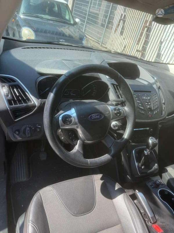 Black Ford Kuga 2015 in Kaunas, with an engine capacity of 2.00 L and mileage of 150 thousand km for 8950 €, photo 6 on AUTOMOTO.COM.LV