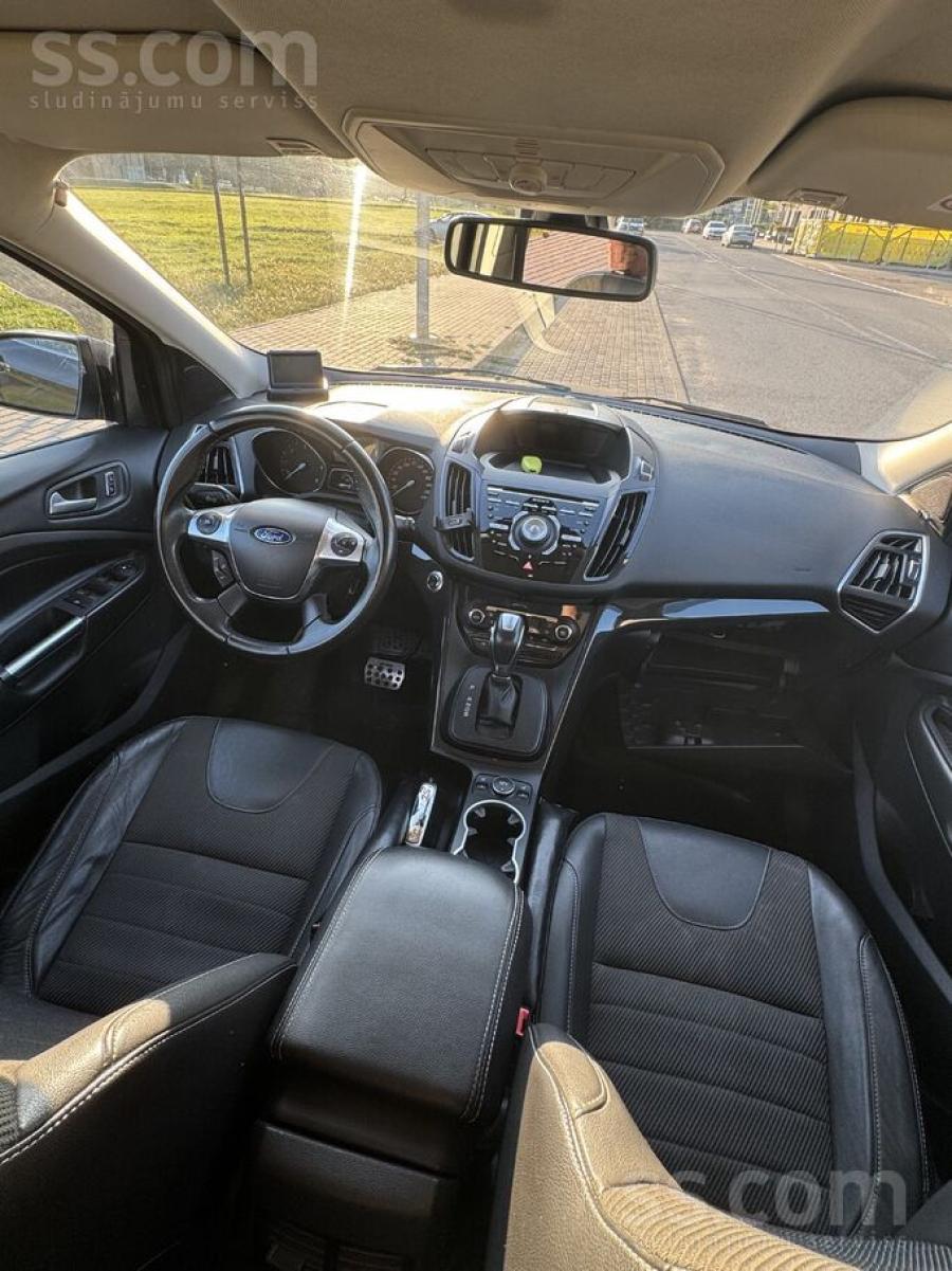 Black Ford Kuga 2015 in Riga, with an engine capacity of 2.00 L and mileage of 115 thousand km for 9500 €, photo 8 on AUTOMOTO.COM.LV