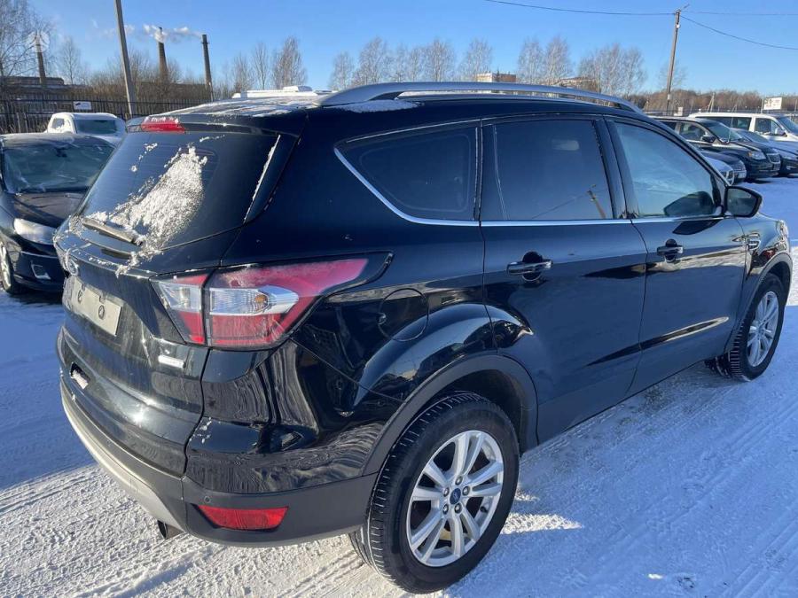 Black Ford Kuga 2016 in Panevezys, with an engine capacity of 1.50 L and mileage of 189 thousand km for 8200 €, photo 4 on AUTOMOTO.COM.LV