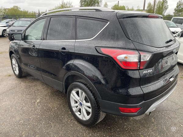Black Ford Kuga 2016 in Panevezys, with an engine capacity of 1.50 L and mileage of 189 thousand km for 8300 €, photo 7 on AUTOMOTO.COM.LV