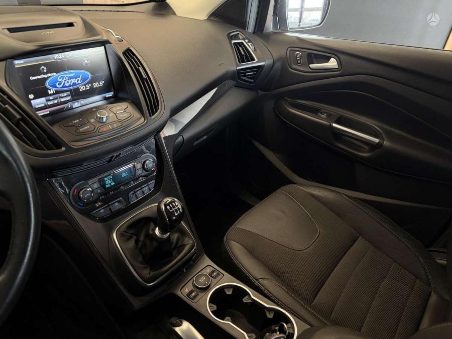 Black Ford Kuga 2016 in Kaunas, with an engine capacity of 1.50 L and mileage of 117 thousand km for 8990 €, photo 20 on AUTOMOTO.COM.LV