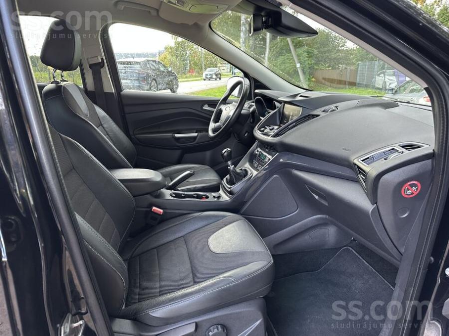 Black Ford Kuga 2016 in Riga, with an engine capacity of 1.50 L and mileage of 119 thousand km for 9990 €, photo 18 on AUTOMOTO.COM.LV