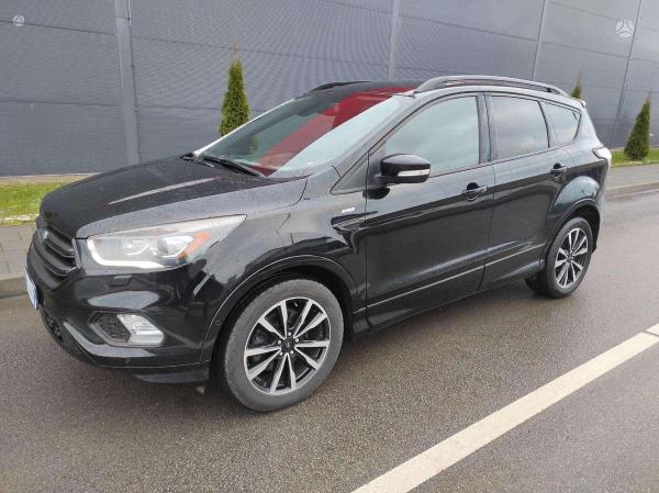 Black Ford Kuga 2017 in Panevezys, with an engine capacity of 1.50 L and mileage of 256 thousand km for 9900 €, photo 1 on AUTOMOTO.COM.LV