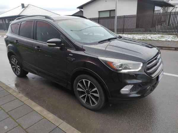 Black Ford Kuga 2017 in Panevezys, with an engine capacity of 1.50 L and mileage of 256 thousand km for 9900 €, photo 7 on AUTOMOTO.COM.LV