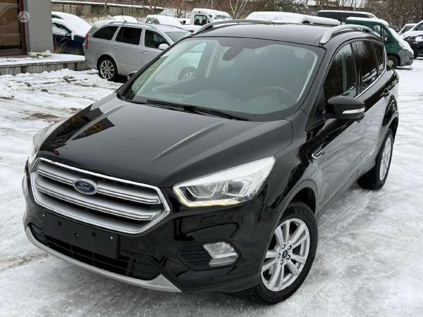 Black Ford Kuga 2017 in Utena, with an engine capacity of 1.50 L and mileage of 106 thousand km for 11250 €, photo 1 on AUTOMOTO.COM.LV