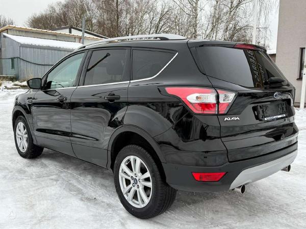Black Ford Kuga 2017 in Utena, with an engine capacity of 1.50 L and mileage of 106 thousand km for 11250 €, photo 3 on AUTOMOTO.COM.LV