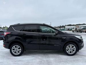Black Ford Kuga 2017 in Utena, with an engine capacity of 1.50 L and mileage of 106 thousand km for 11250 €, photo 7 on AUTOMOTO.COM.LV