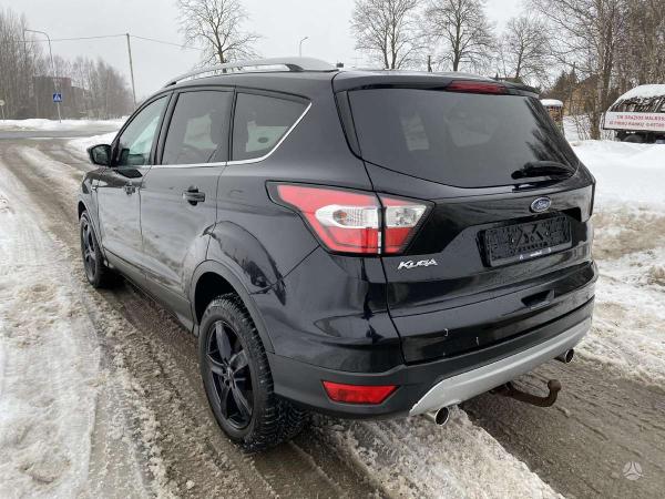 Black Ford Kuga 2017 in Panevezys, with an engine capacity of 2.00 L and mileage of 295 thousand km for 8800 €, photo 5 on AUTOMOTO.COM.LV