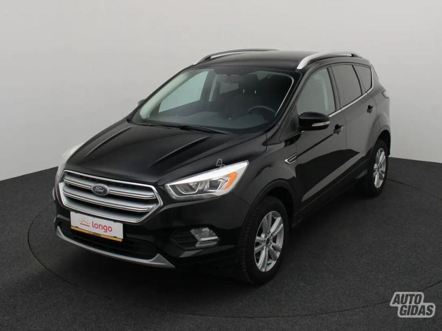 Black Ford Kuga 2017 in Vilnius, with an engine capacity of 1.50 L and mileage of 141 thousand km for 10099 €, photo 1 on AUTOMOTO.COM.LV