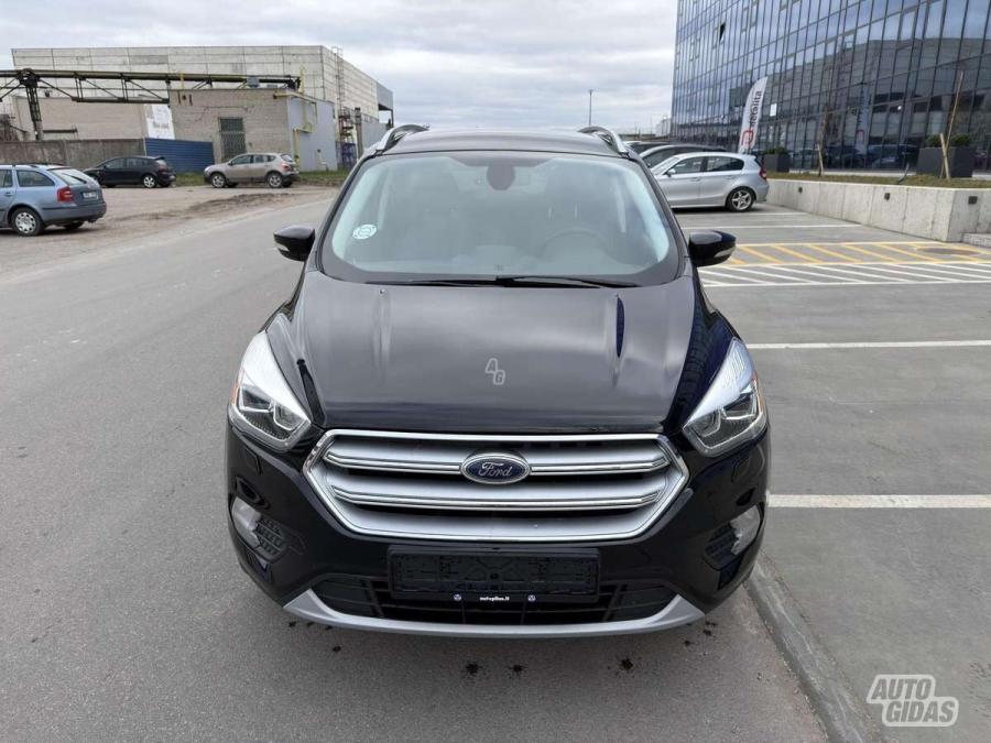 Black Ford Kuga 2017 in Kaunas, with an engine capacity of 2.00 L and mileage of 295 thousand km for 8200 €, photo 6 on AUTOMOTO.COM.LV